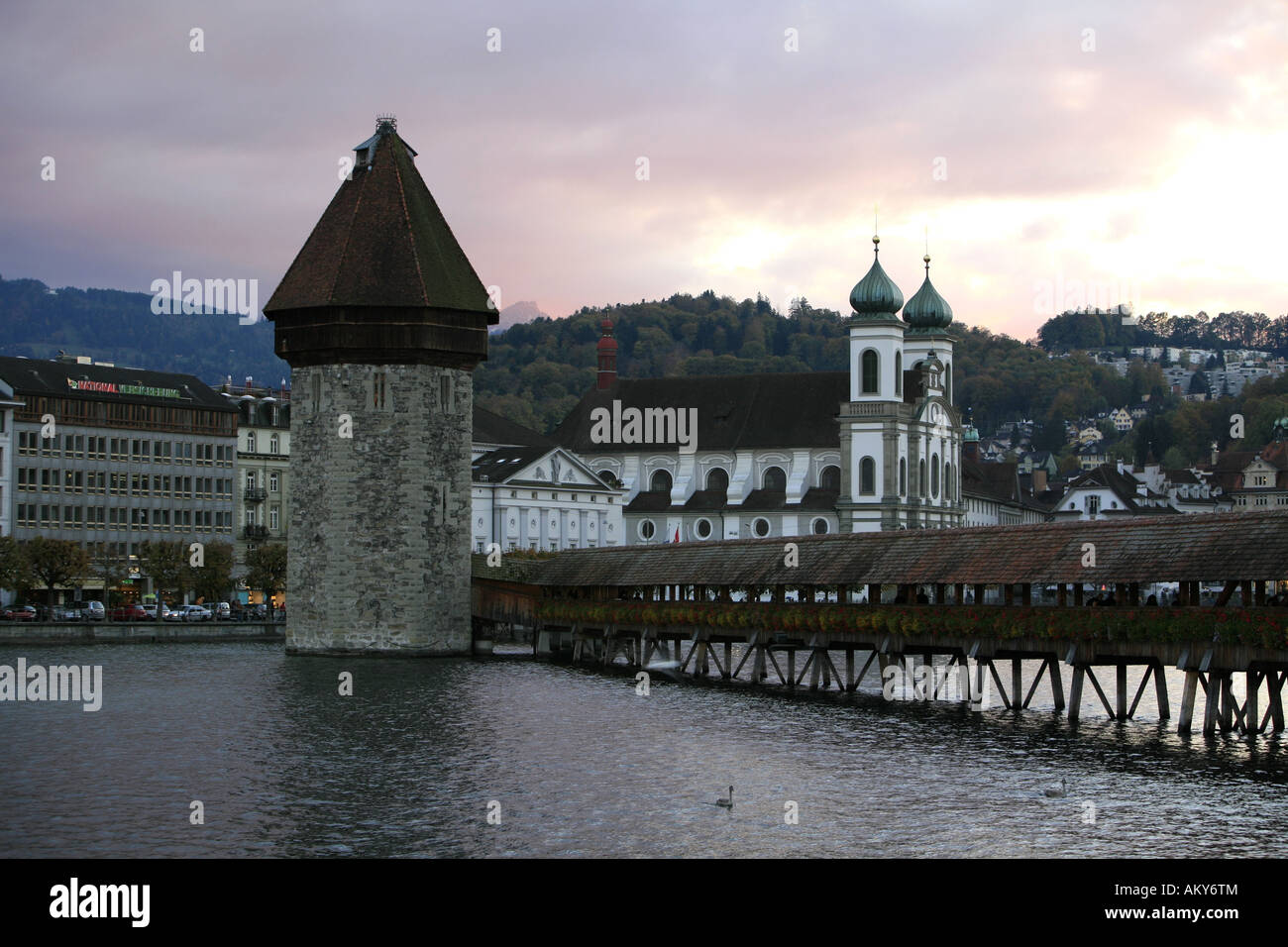 Jesuit Church and Kapell Bridge with Water Tower across the Reuss River ...
