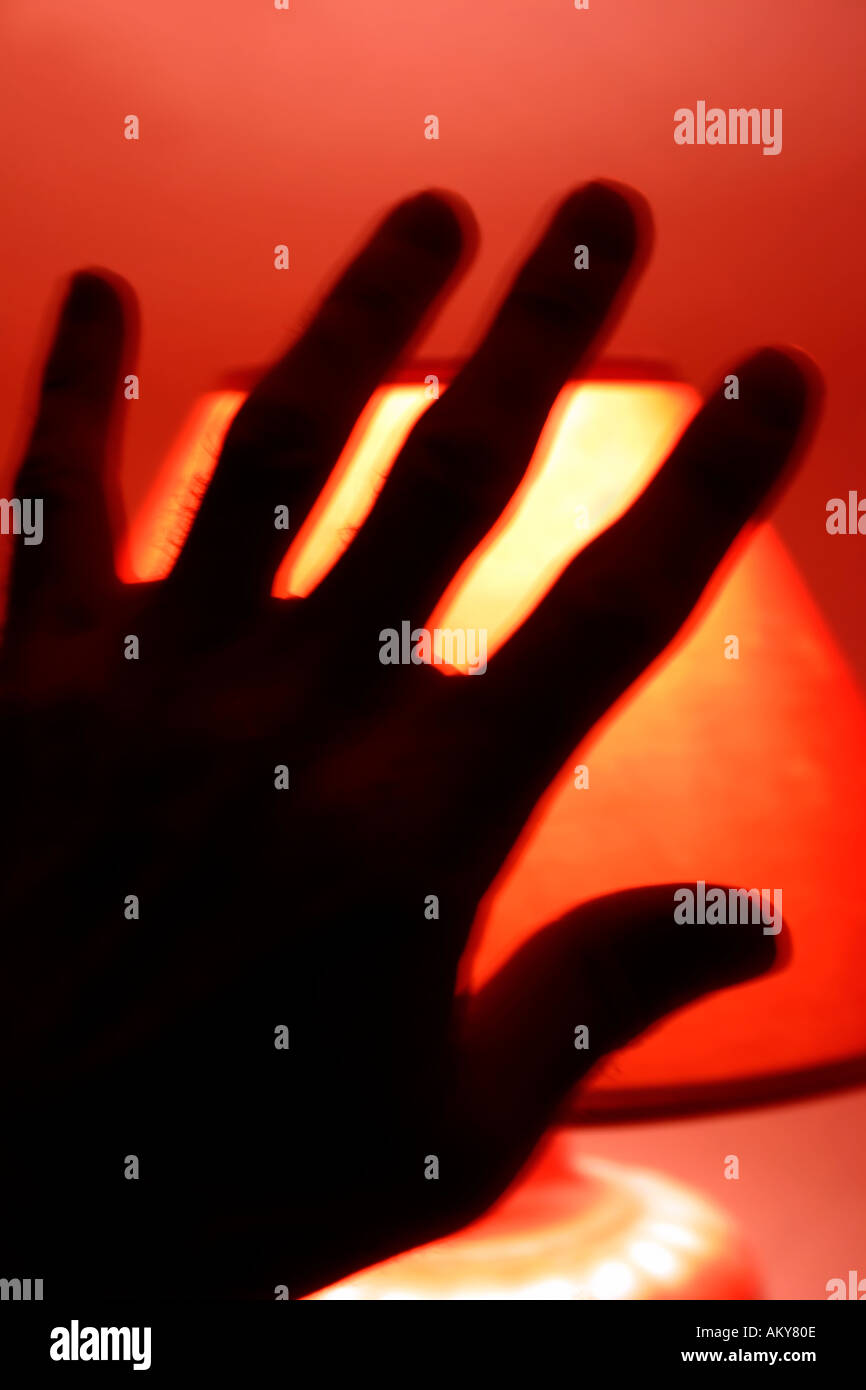 Hand covering light Stock Photo - Alamy