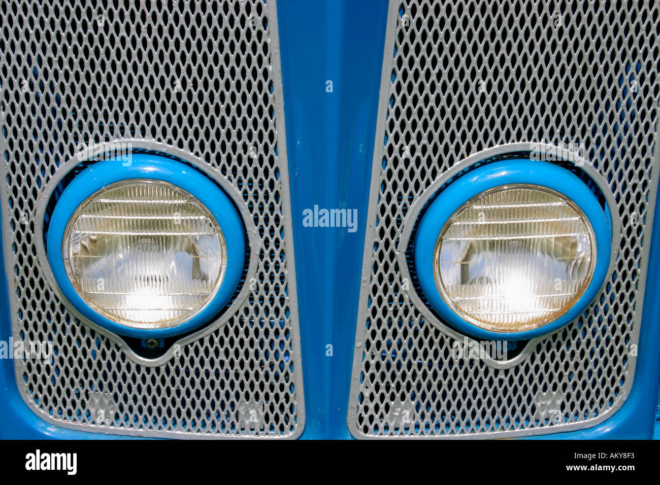 Grille and headlights of old tractor Stock Photo - Alamy