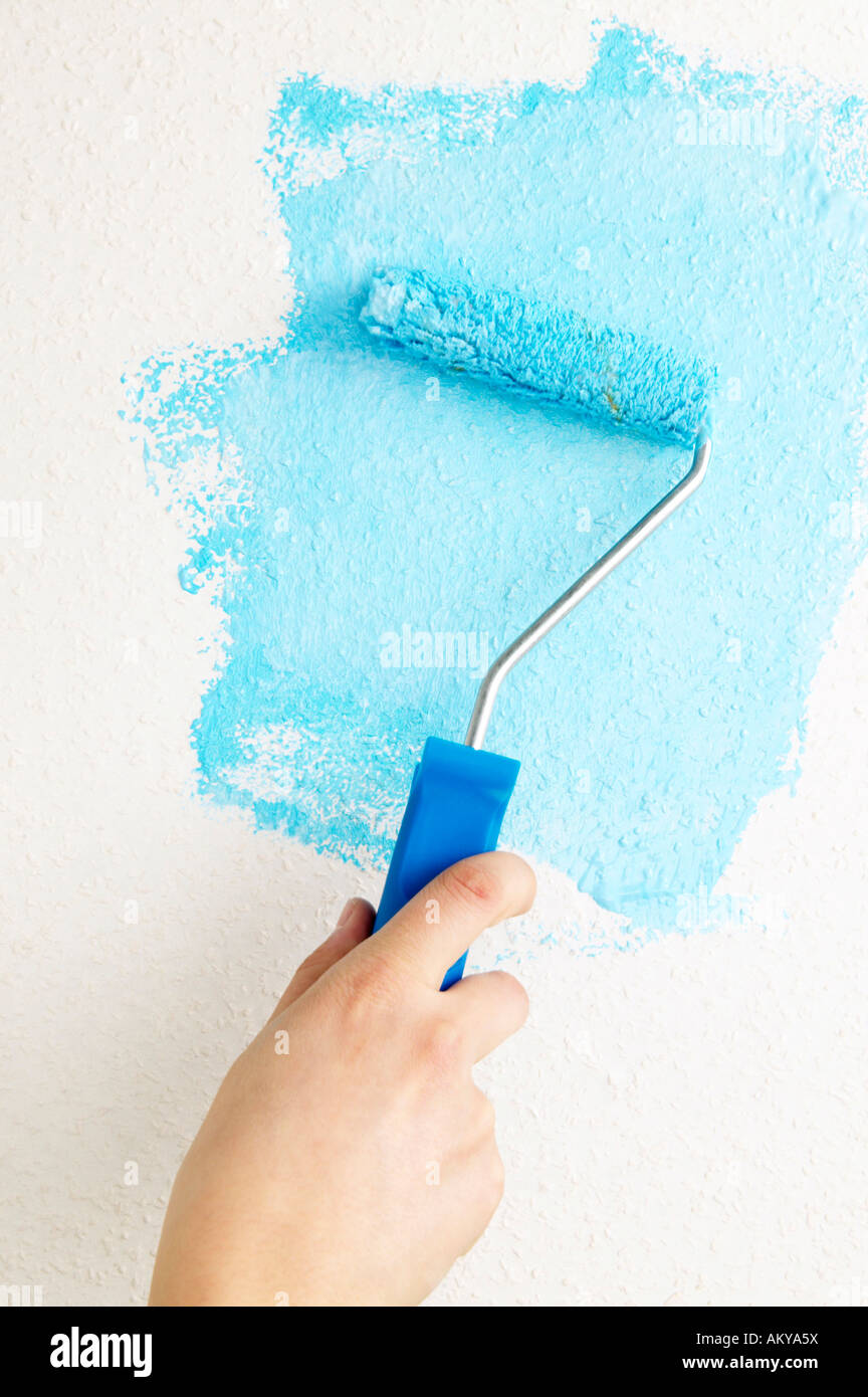 Person painting wall, close-up Stock Photo - Alamy