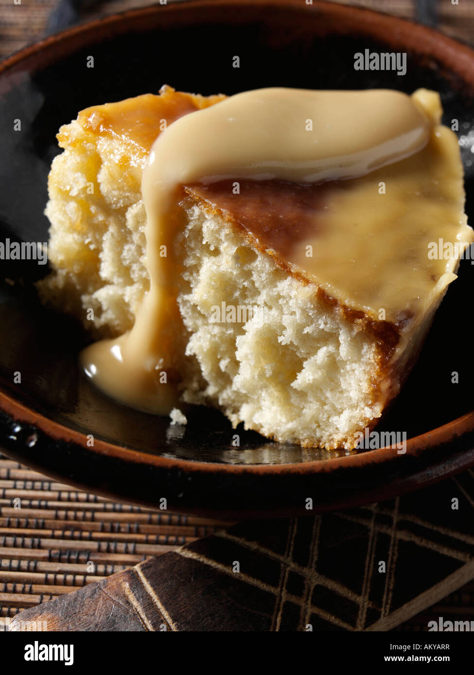 A slice of traditional South African Malva pudding vegetarian editorial ...