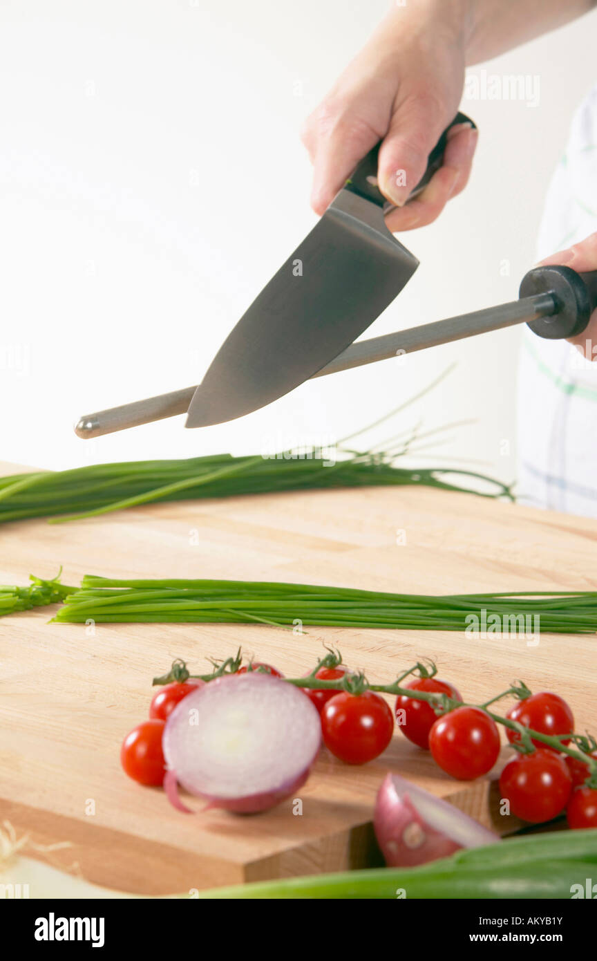 Man sharpening knife, close-up Stock Photo - Alamy