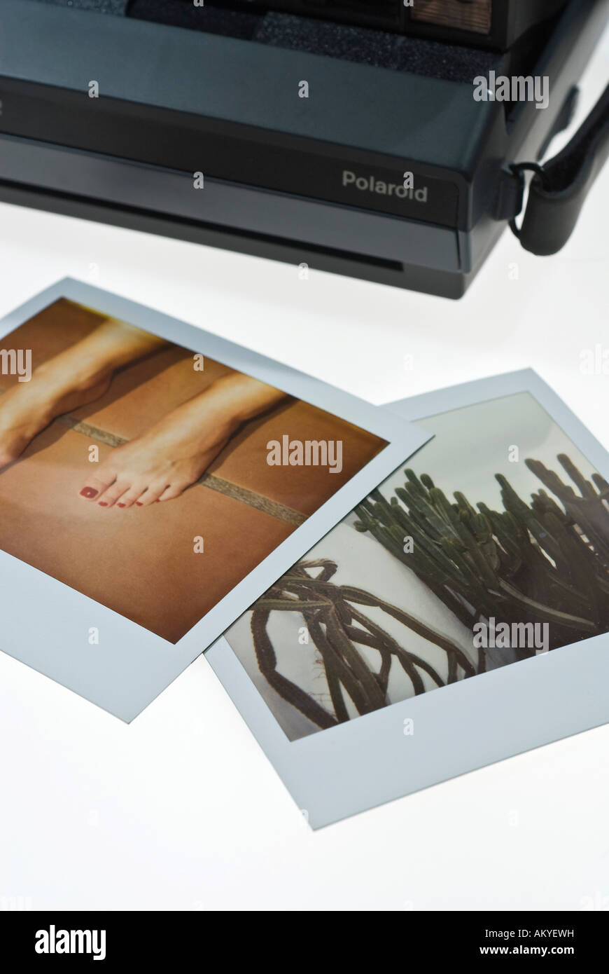 Polaroid camera and photos Stock Photo - Alamy