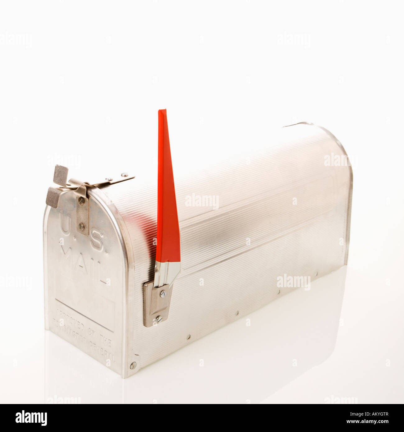 Shiny silver metal mailbox with flag up Stock Photo - Alamy