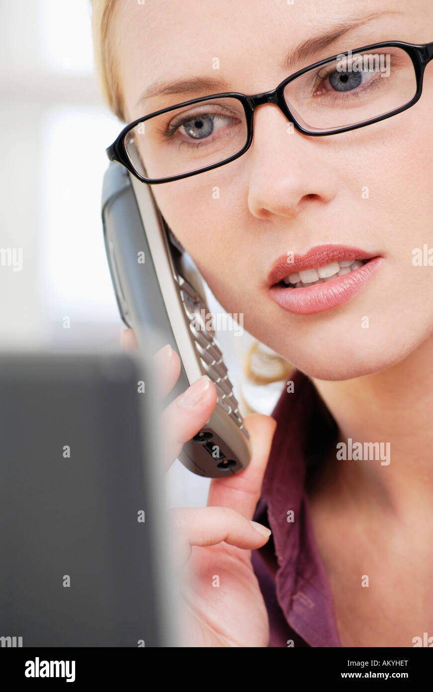 Woman in office using phone, close-up Stock Photo - Alamy