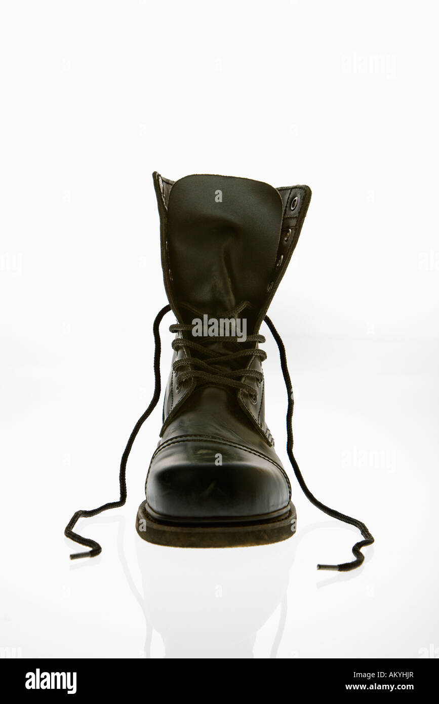 One black leather high top boots with untied laces Stock Photo - Alamy