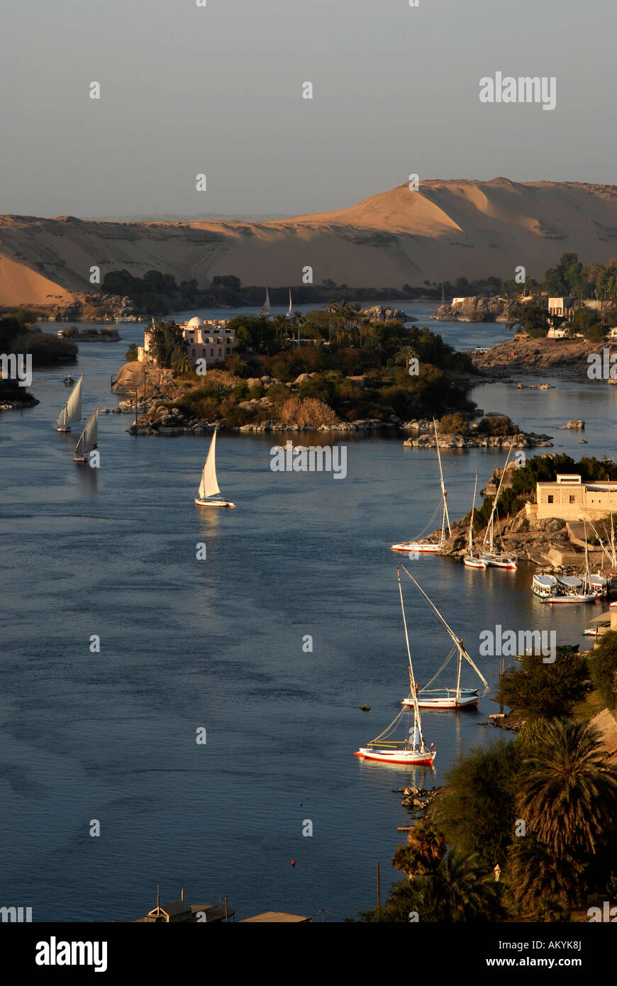 Nile cataract - Rocks and vortices in the river. Evening light over the ...