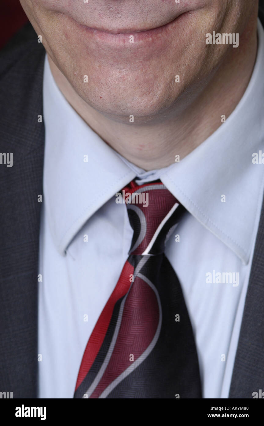 A close up of a man's lower face and neck, dressed in a suit Stock ...