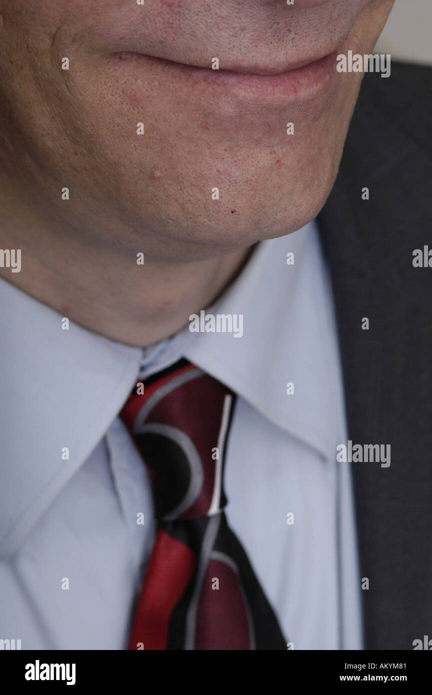 A close up of a man's lower face and neck, dressed in a suit Stock ...