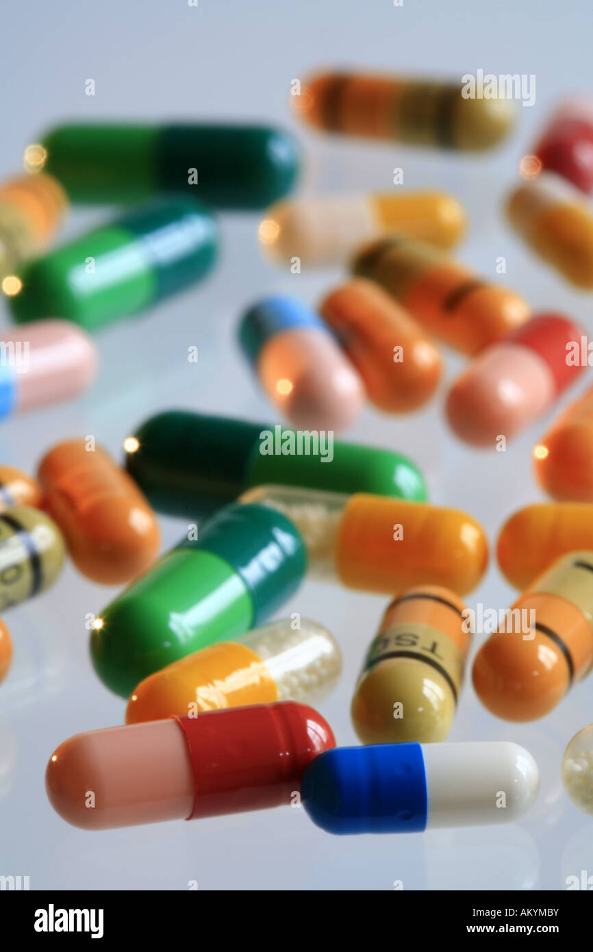 Different colourful pill capsules Stock Photo - Alamy