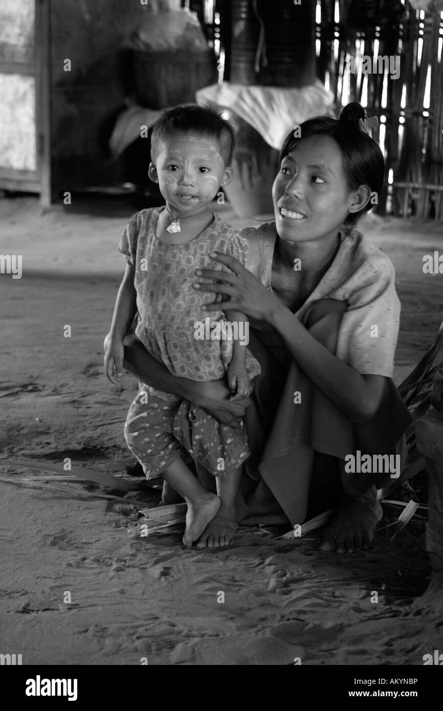 Burmese mother and child at a village between Bagan and Mount Popa ...