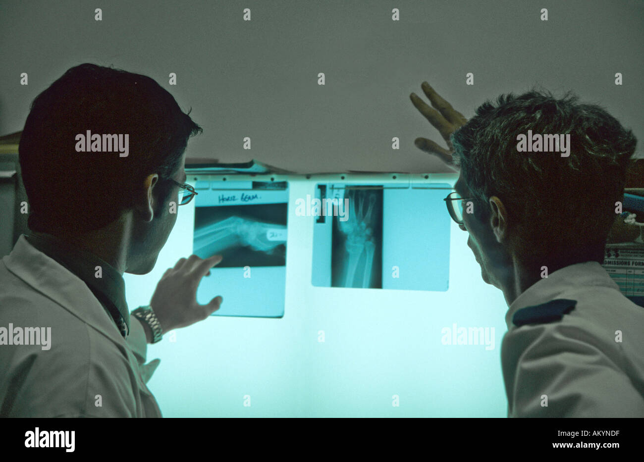 doctor and male nurse viewing radiograph x ray on light box Stock Photo ...