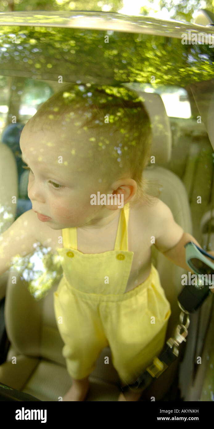 Child is standing in a car Stock Photo - Alamy