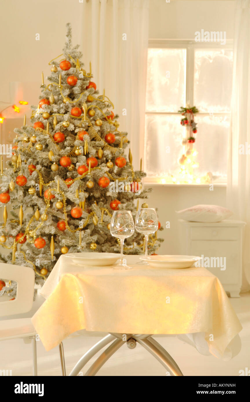 Table in front of a Christmas tree Stock Photo - Alamy
