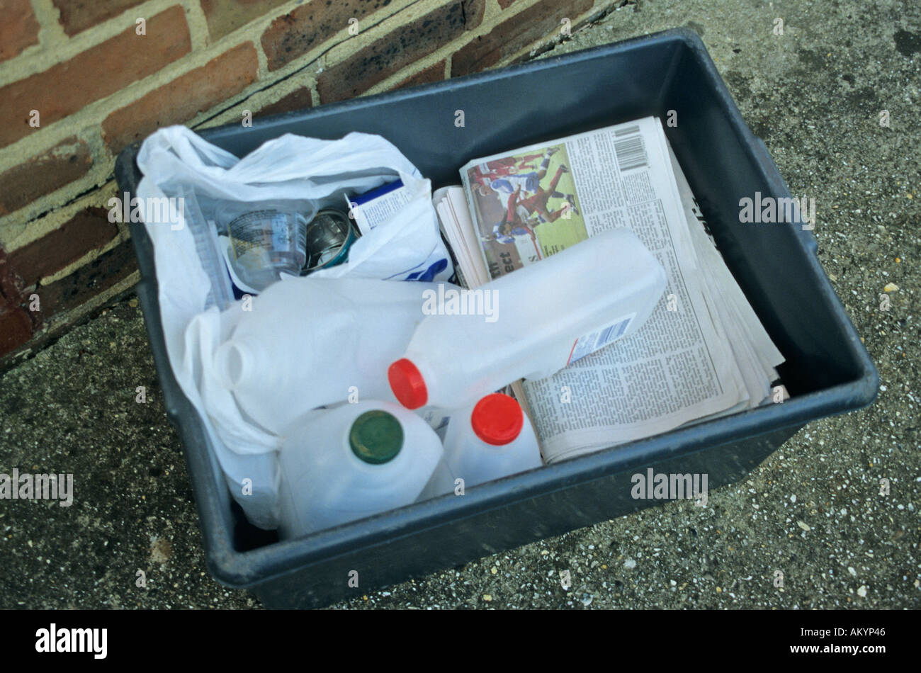recycling collection box filled with plastics and newspapers for ...