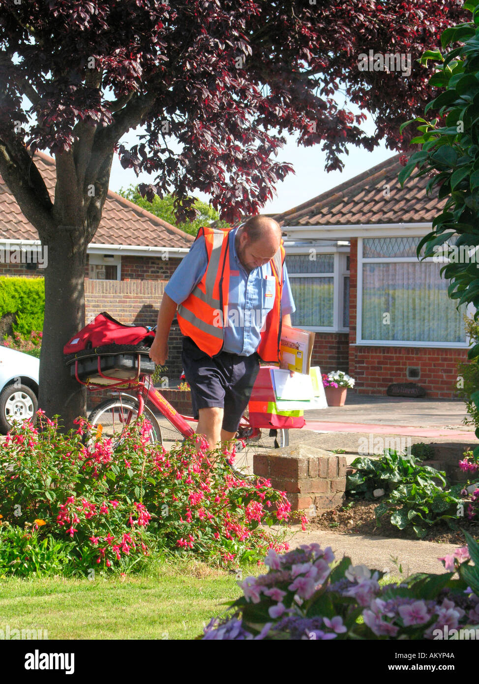Postman delivering letters parcels hi-res stock photography and images ...