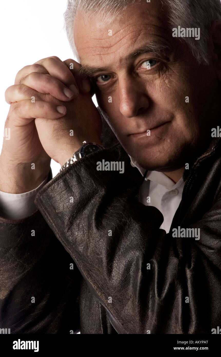 An older gentleman clasping his hands Stock Photo - Alamy