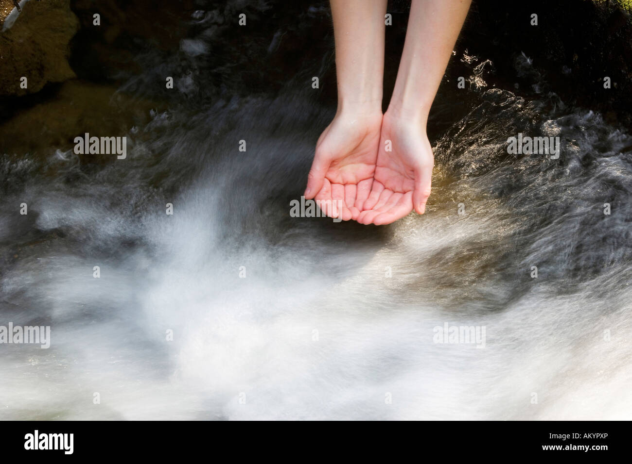 Person cupping water from stream, close-up Stock Photo - Alamy