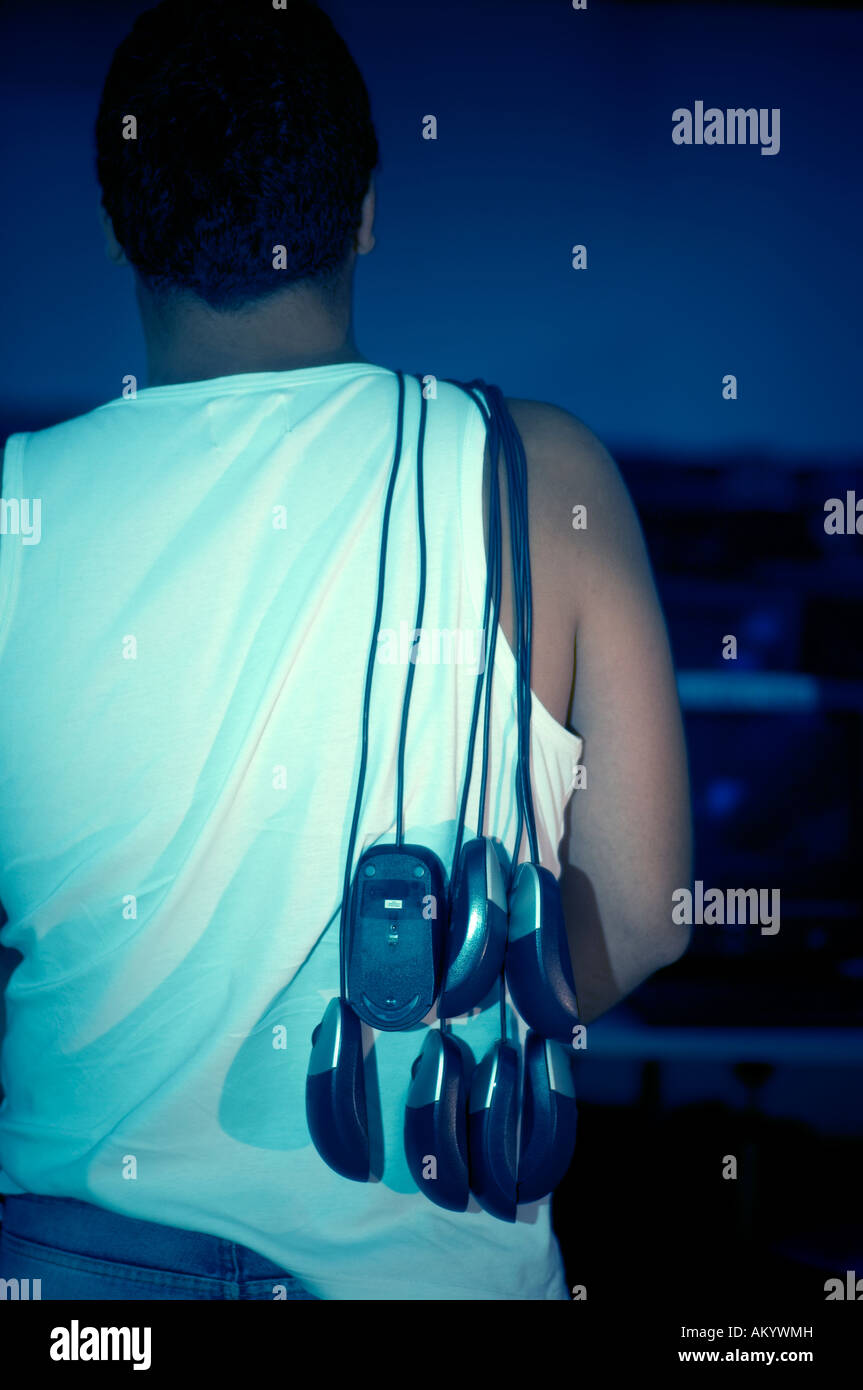 Man holding many computer mouses behind his back Stock Photo - Alamy