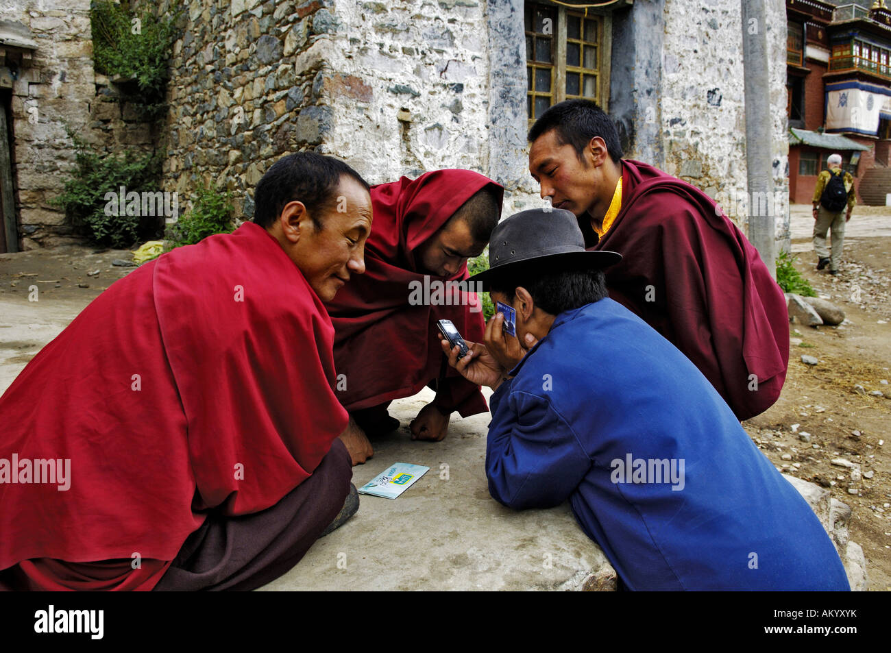 Monks with a mobile phone, monastery Tshurpu near Lhasa, Tibet, Asia ...