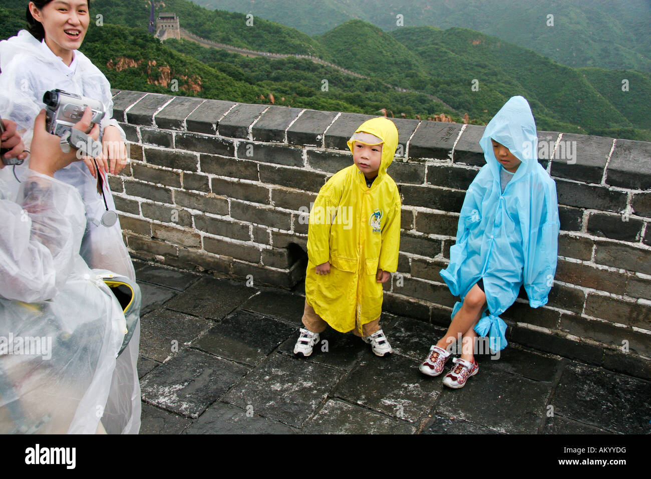 Chinese tourists on the Great Wall of China in the rain, Beijing, China ...