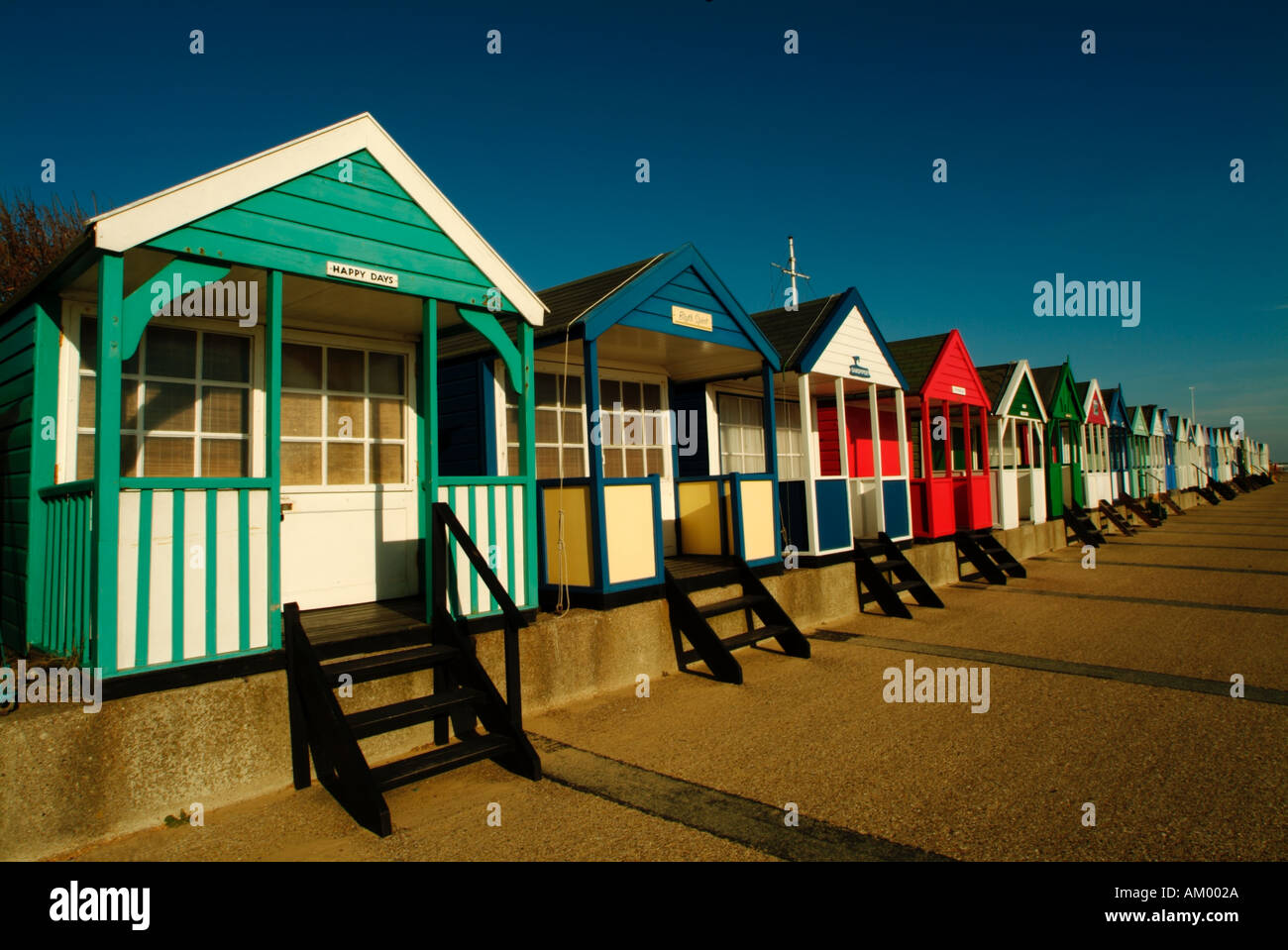 Brightly-painted beach huts Stock Photo - Alamy