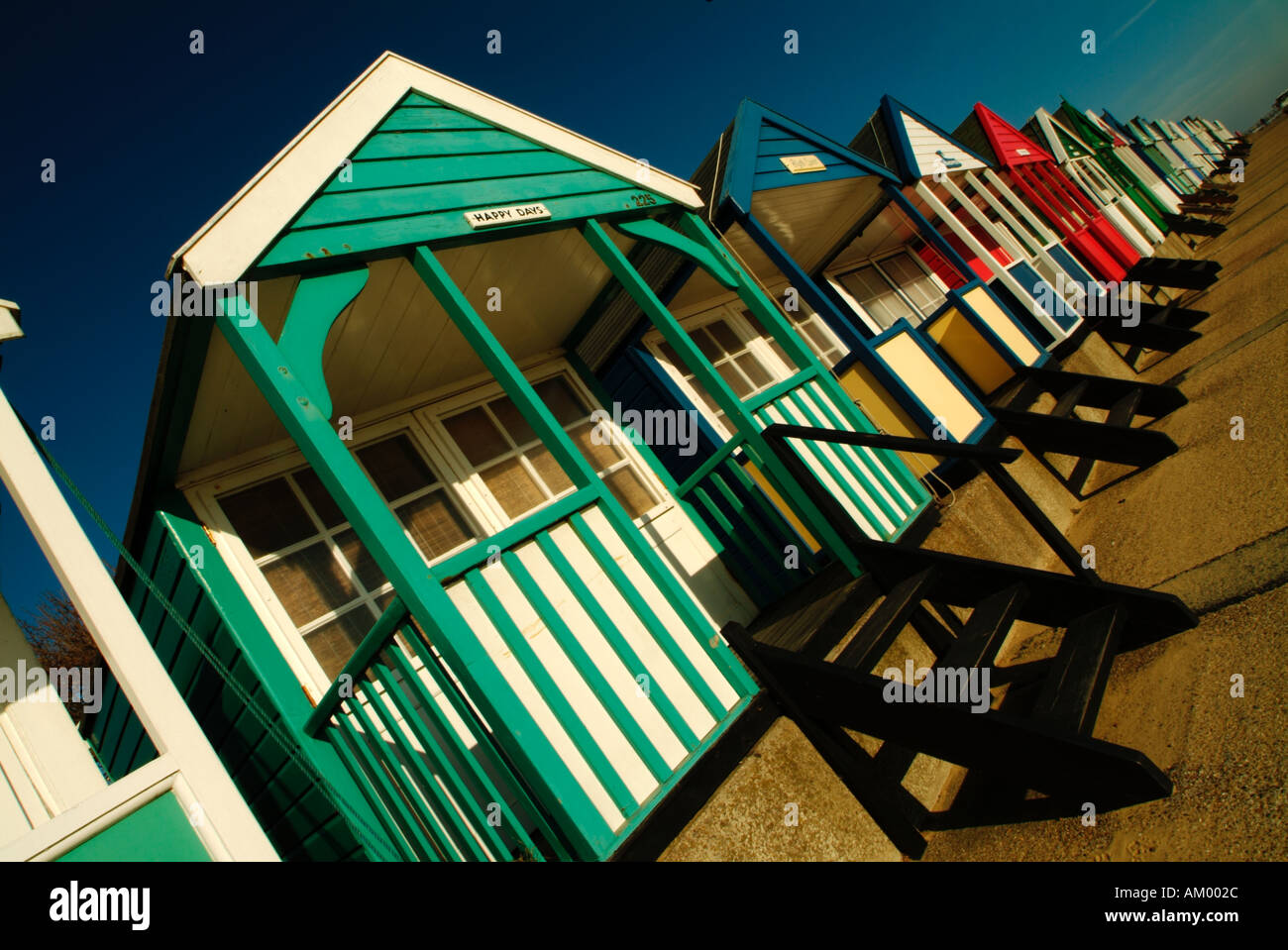 Brightly-painted beach huts Stock Photo - Alamy