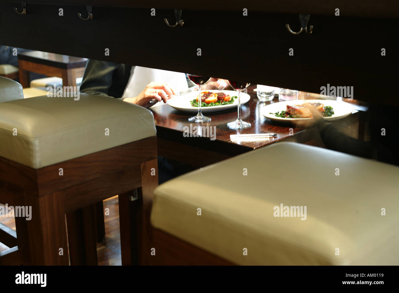 Salt bar London Seat in a bar with people eating in the background ...