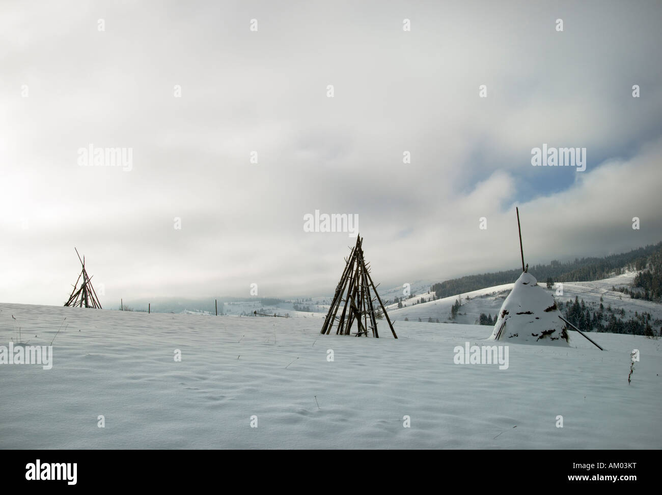 winter mountain landscape with haystack on a forefront Stock Photo - Alamy