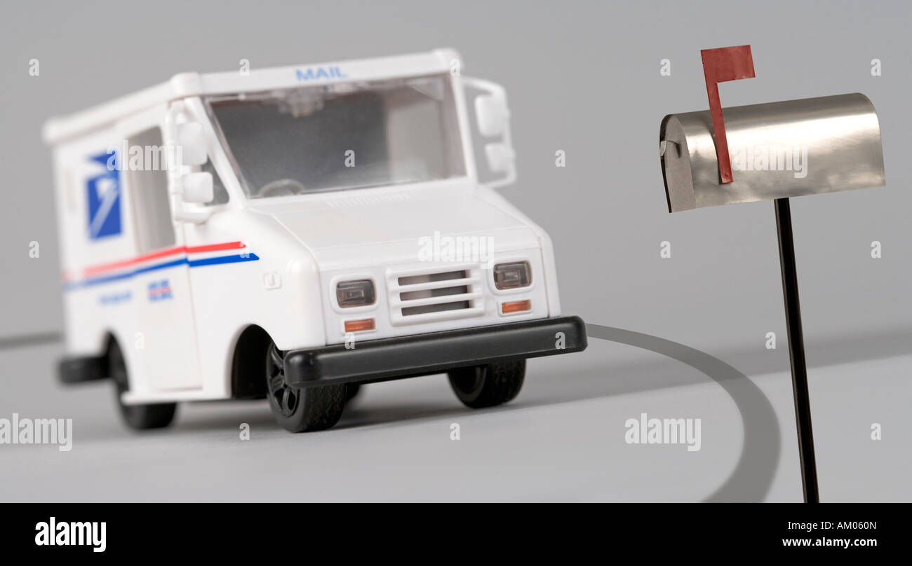 Toy mail truck and mailbox with its red flag up Stock Photo - Alamy