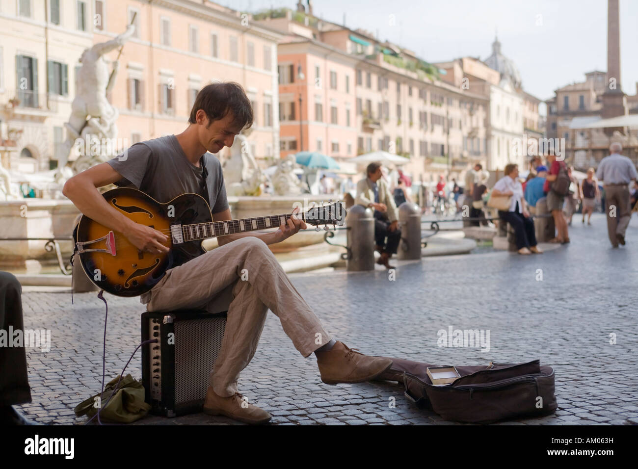 Guitarist busking young man playing hi-res stock photography and images ...
