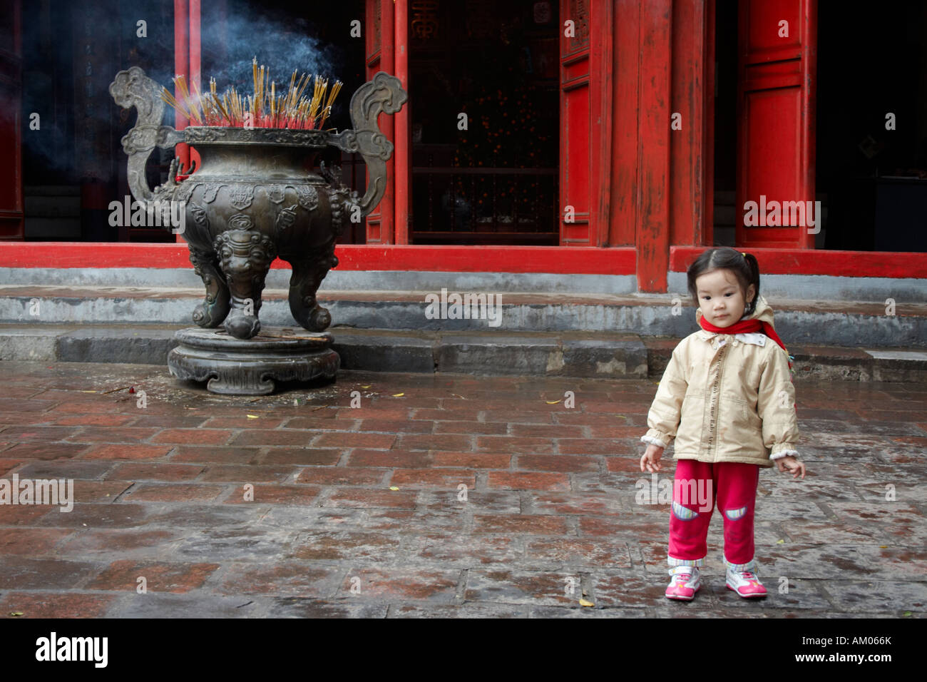 Small Child Stands In The Ngoc Sun (Jade Mountain) Temple, Hanoi ...