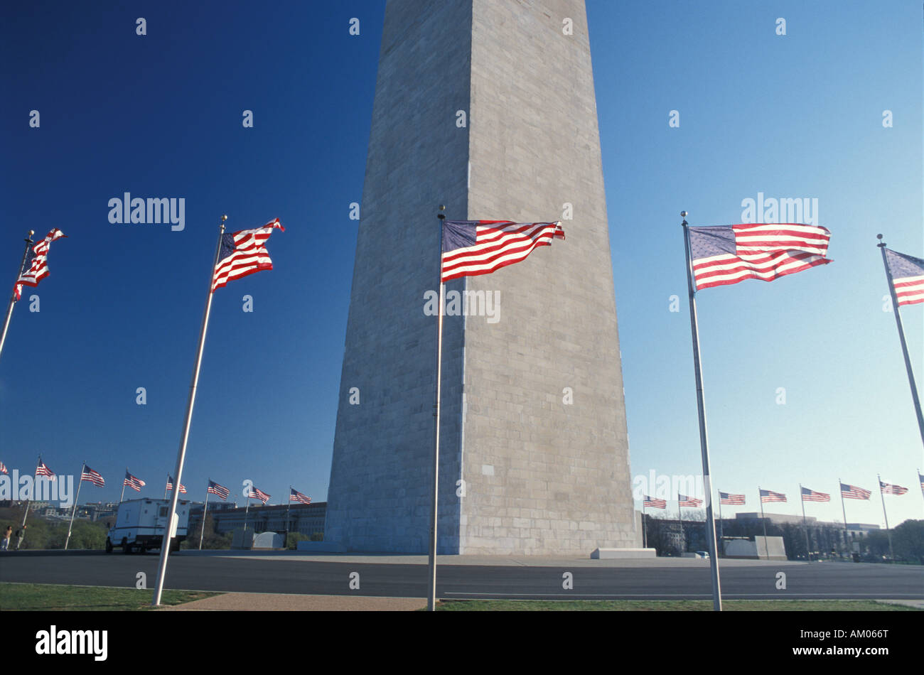 An early morning breeze stirs the American flags surrounding the ...