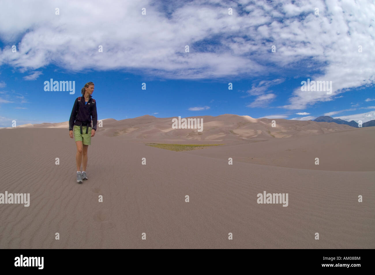 Wende Valentine walks through Great Sand Dunes National Park in the San ...