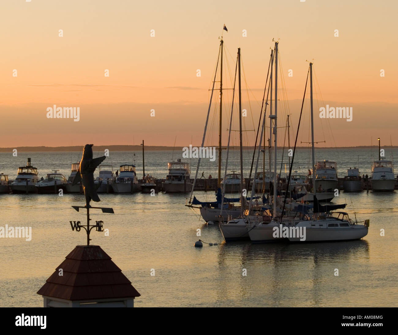 A golden sunset in the harbour of the fishing village of Menemsha ...