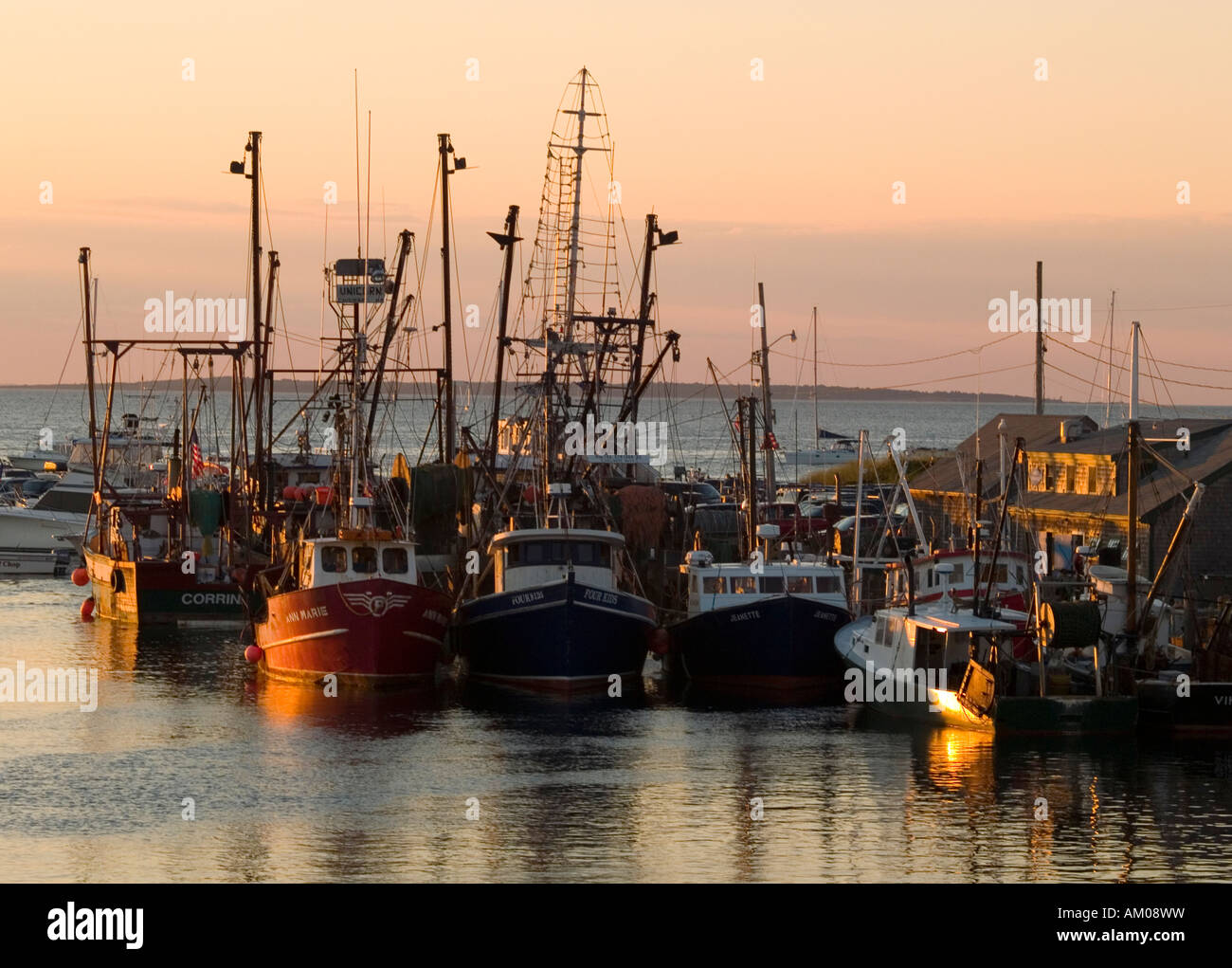 A golden sunset in the harbour of the fishing village of Menemsha ...