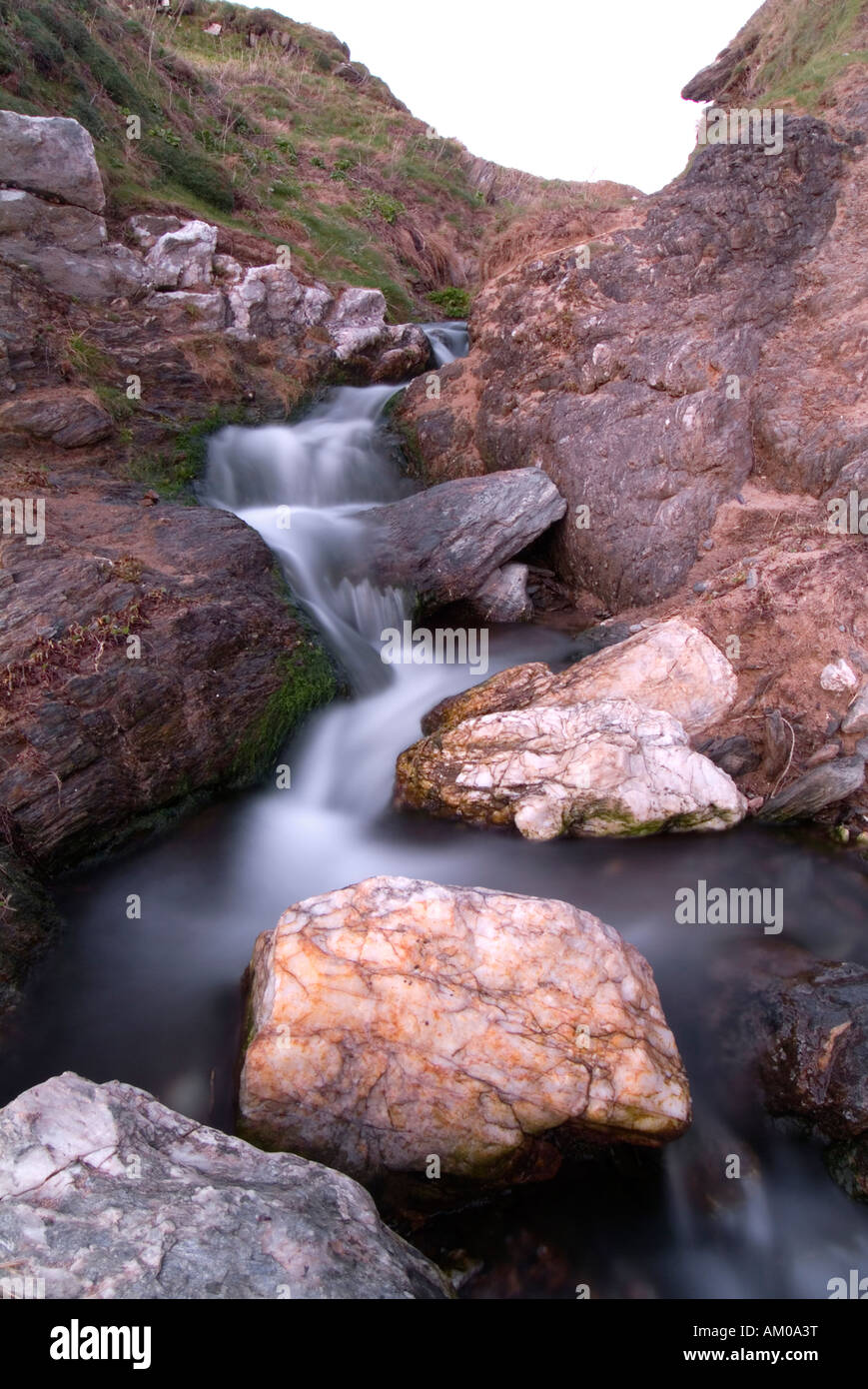 Waterfall at Soar Mill Cove beach in Devon Stock Photo - Alamy
