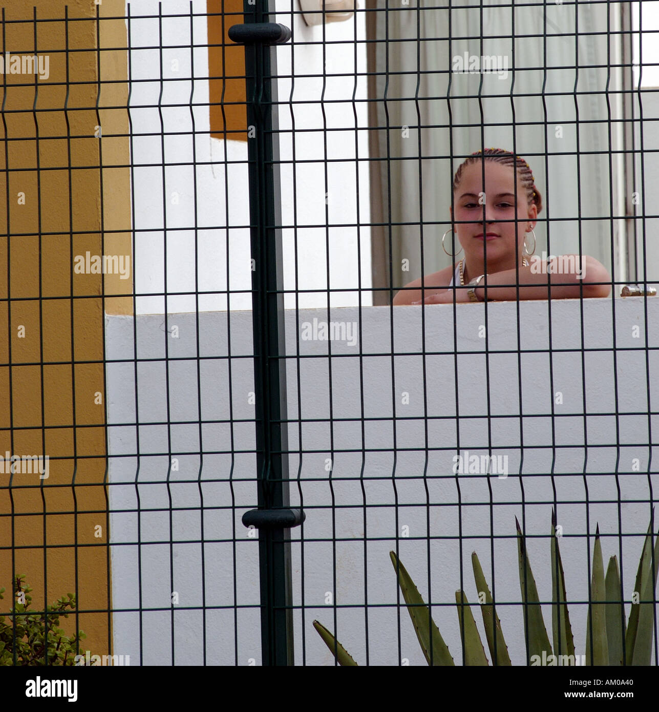 child behind fence Stock Photo - Alamy