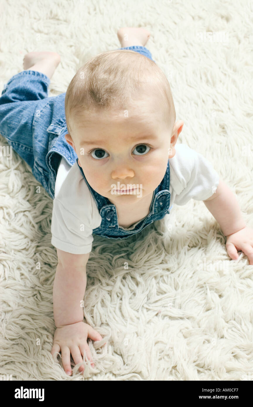 baby lying on front with body supported on arms in the position babies ...