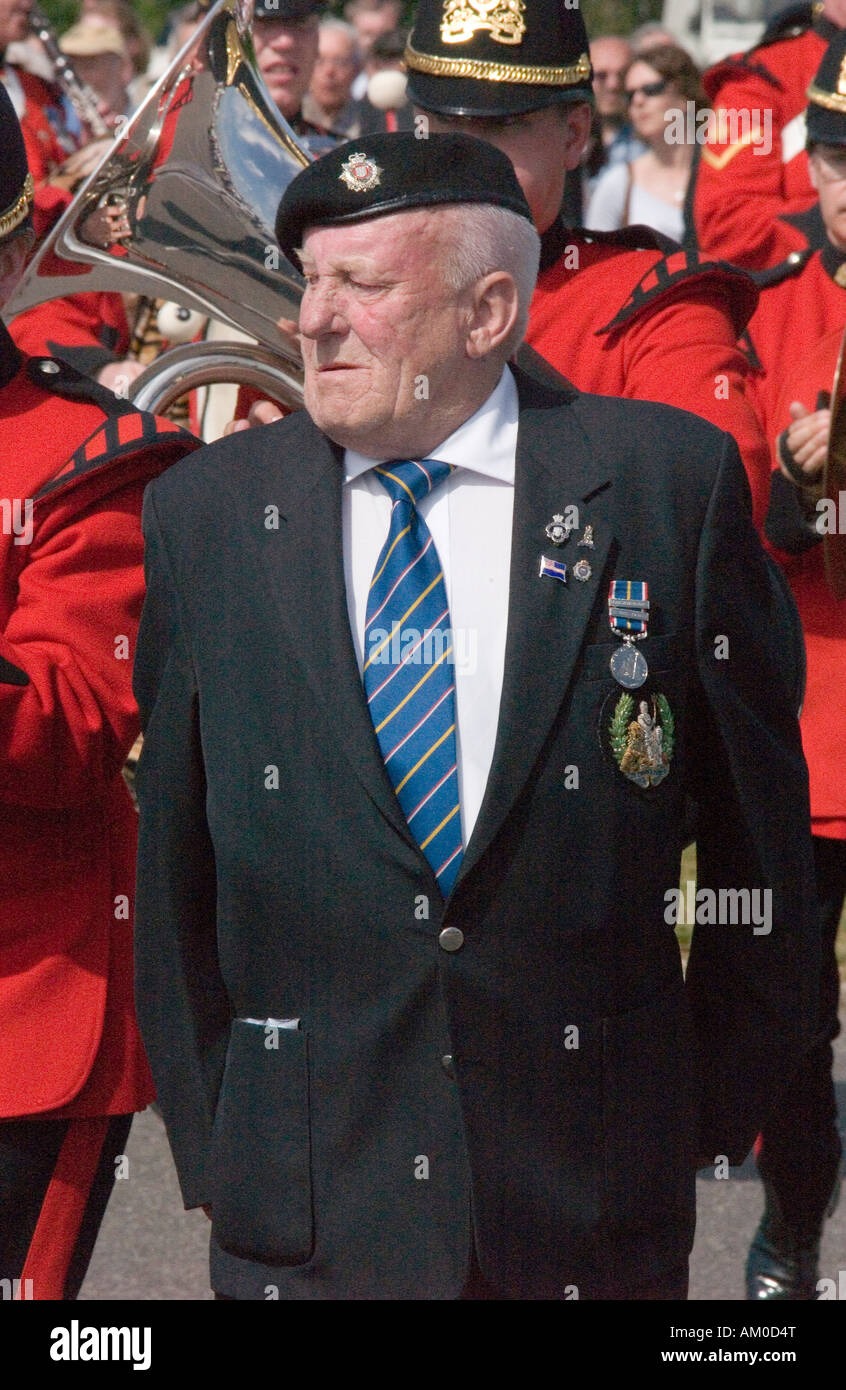 A proud war veteran at a memorial celebration He is wearing his medals ...