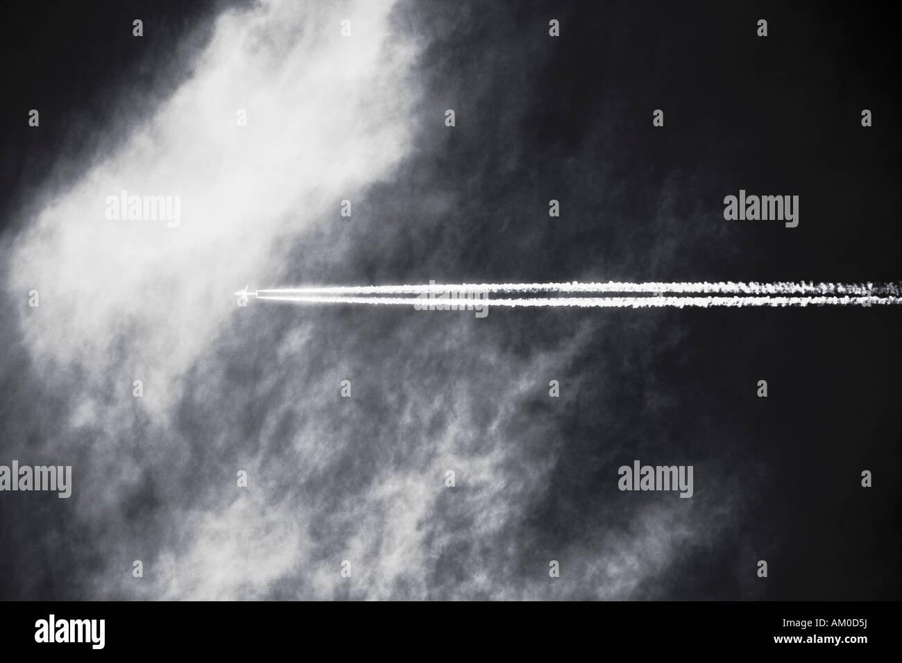 Commercial Airplane Leaving Vapor Trail In The Sky Stock Photo - Alamy