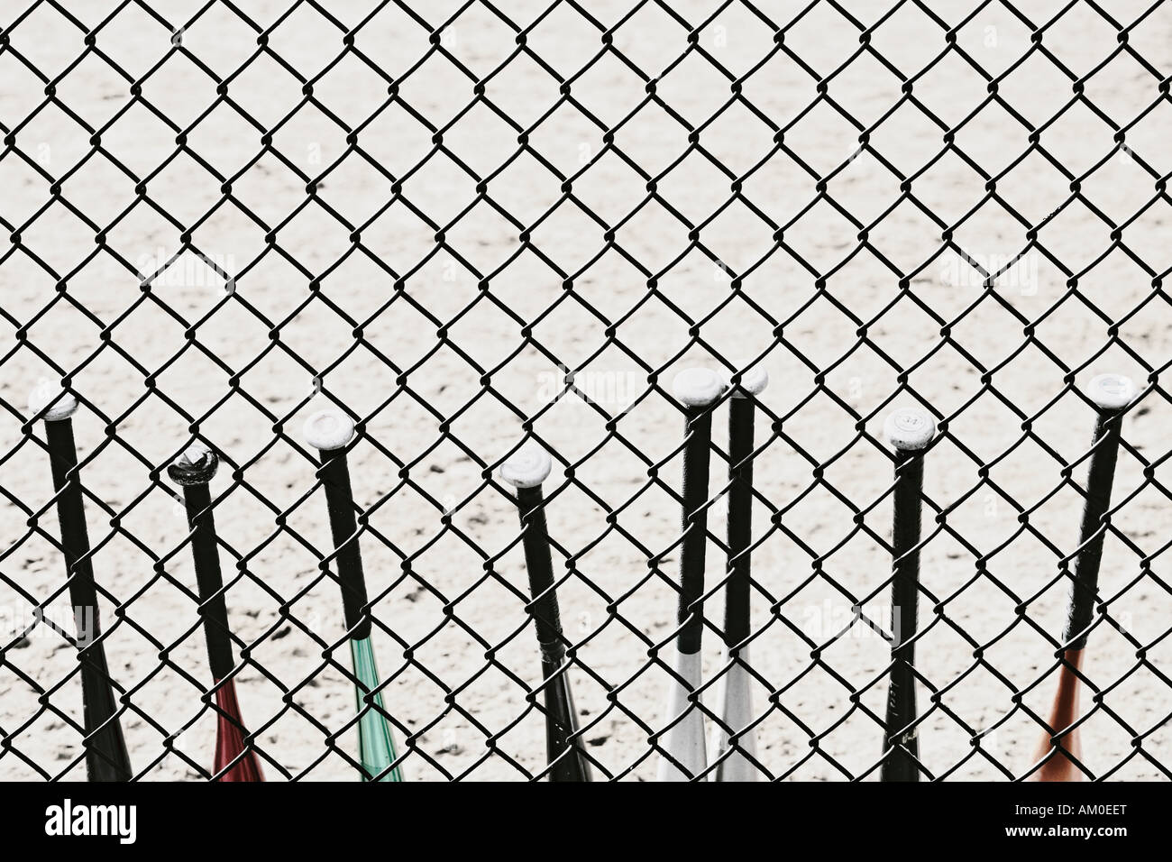 Baseball Bats Leaning Against Chainlink Fence Stock Photo - Alamy