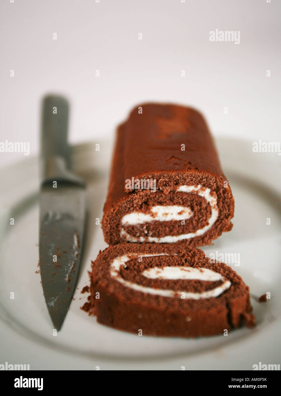 chocolate swiss roll sweet swirl sweets diet junk food Stock Photo - Alamy