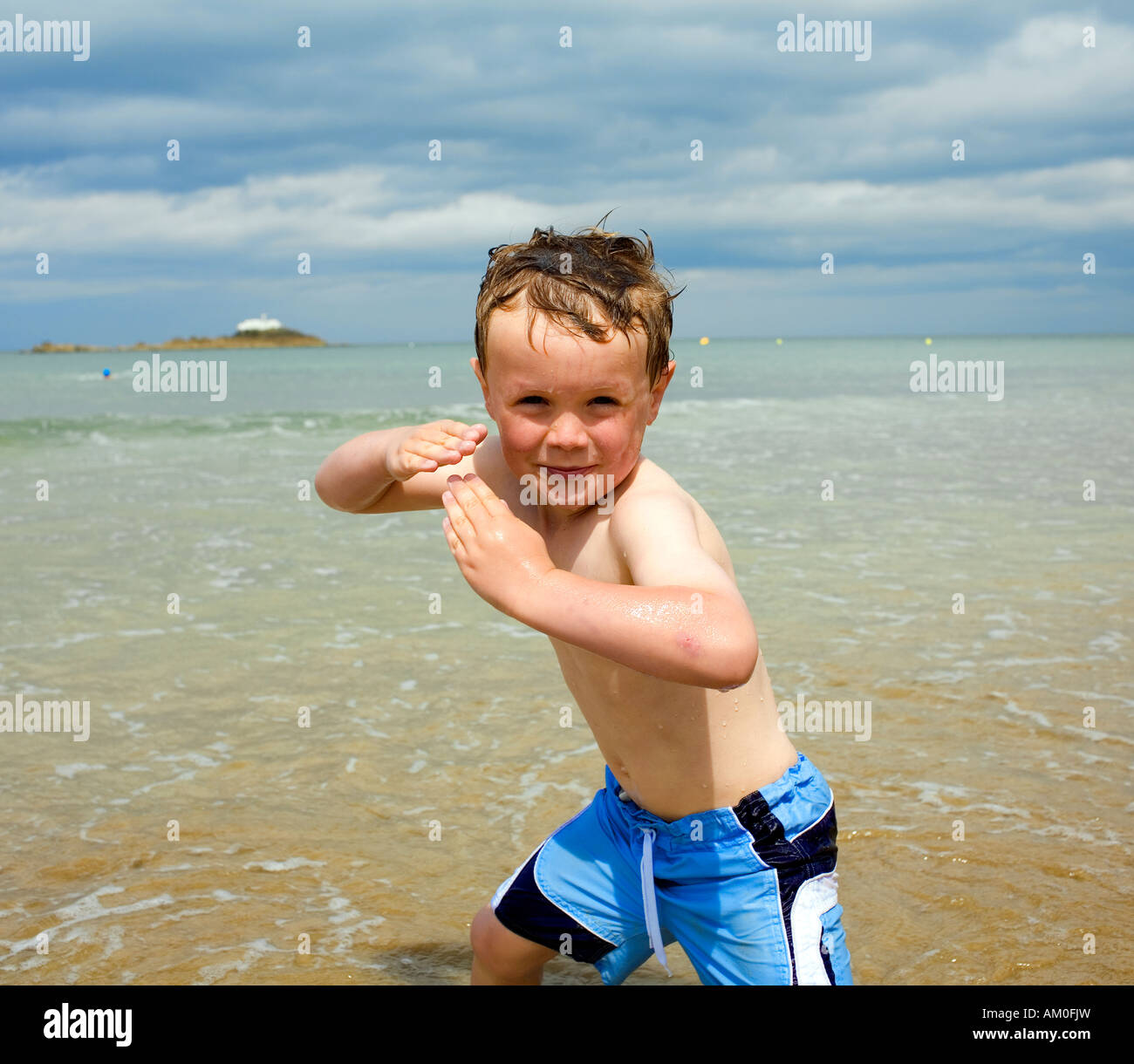 Boy on beach Stock Photo - Alamy