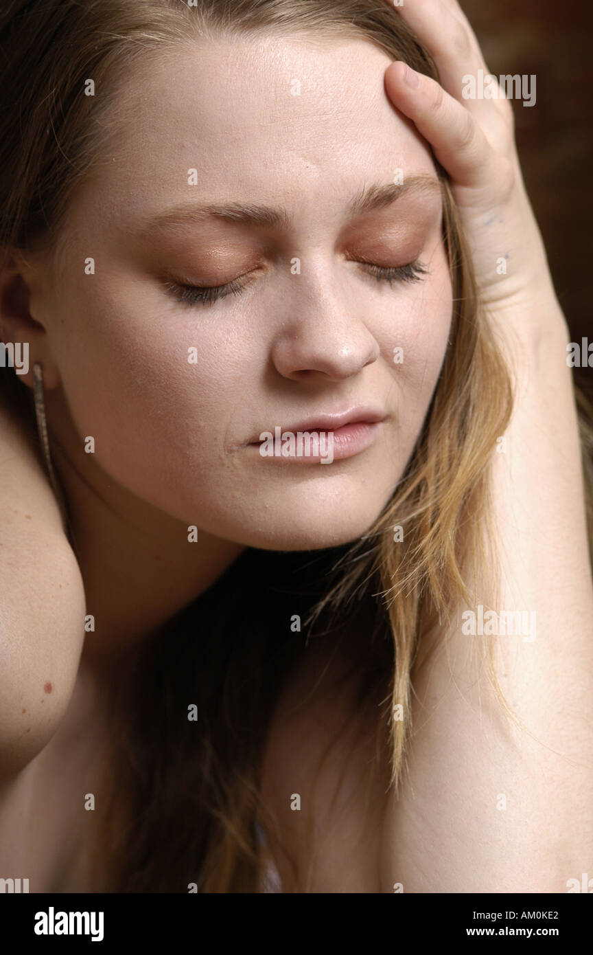 A Caucasian woman showing signs of emotional distress Stock Photo - Alamy