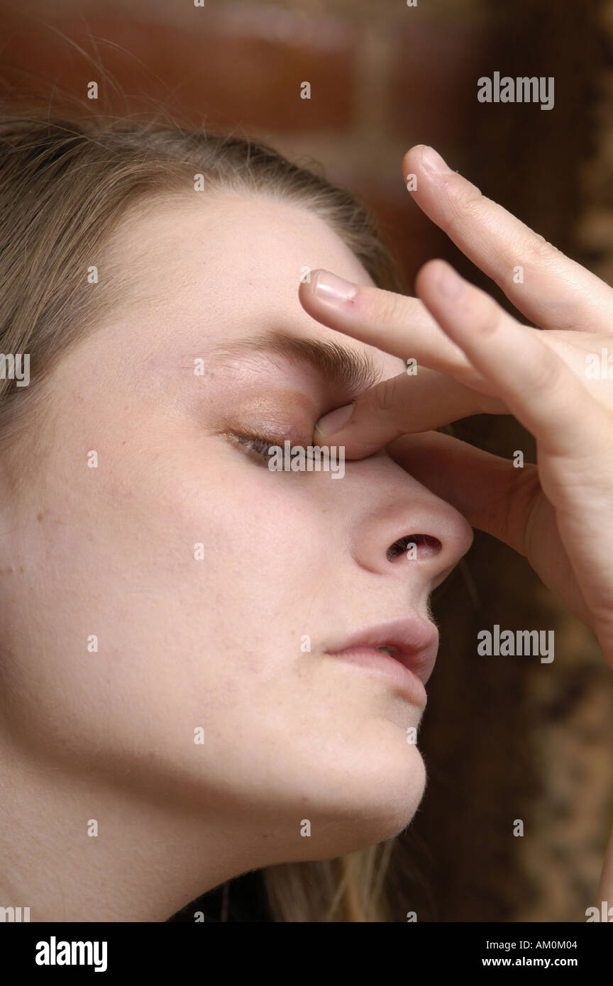 A Caucasian woman showing signs of emotional distress Stock Photo - Alamy