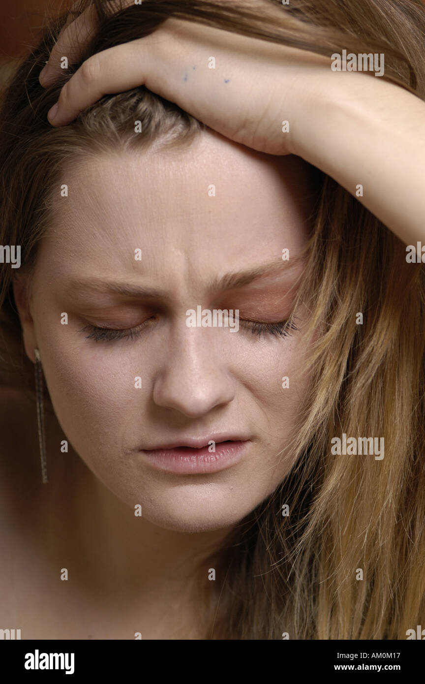A Caucasian woman showing signs of emotional distress Stock Photo - Alamy