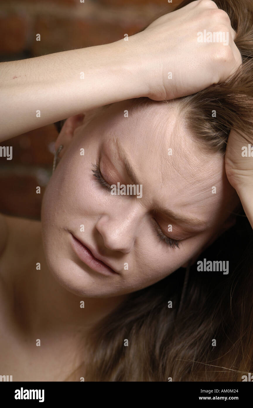 A Caucasian woman showing signs of emotional distress Stock Photo - Alamy
