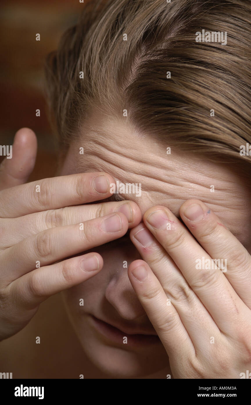 A Caucasian woman showing signs of emotional distress Stock Photo - Alamy
