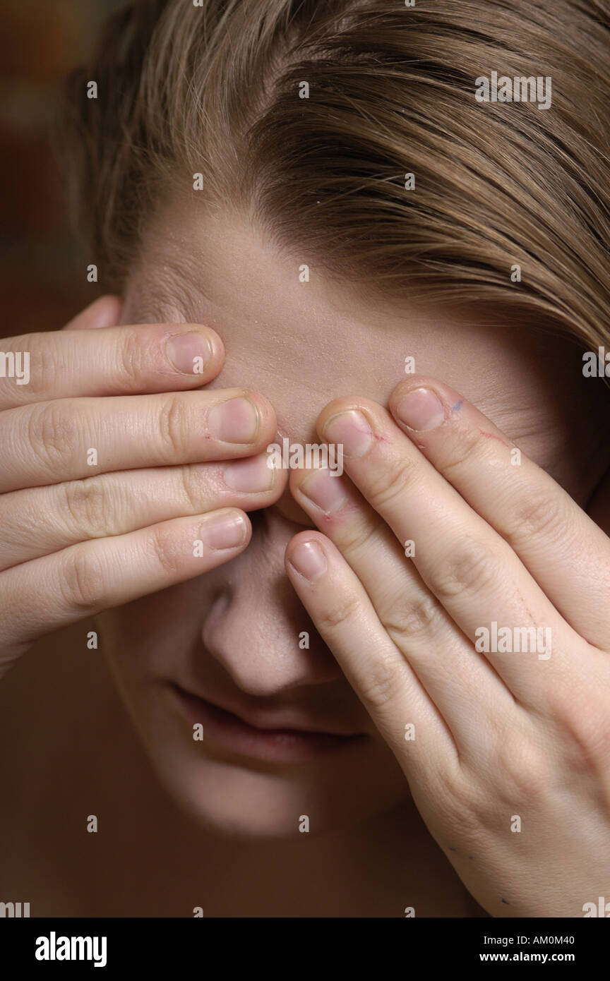 A Caucasian woman showing signs of emotional distress Stock Photo - Alamy